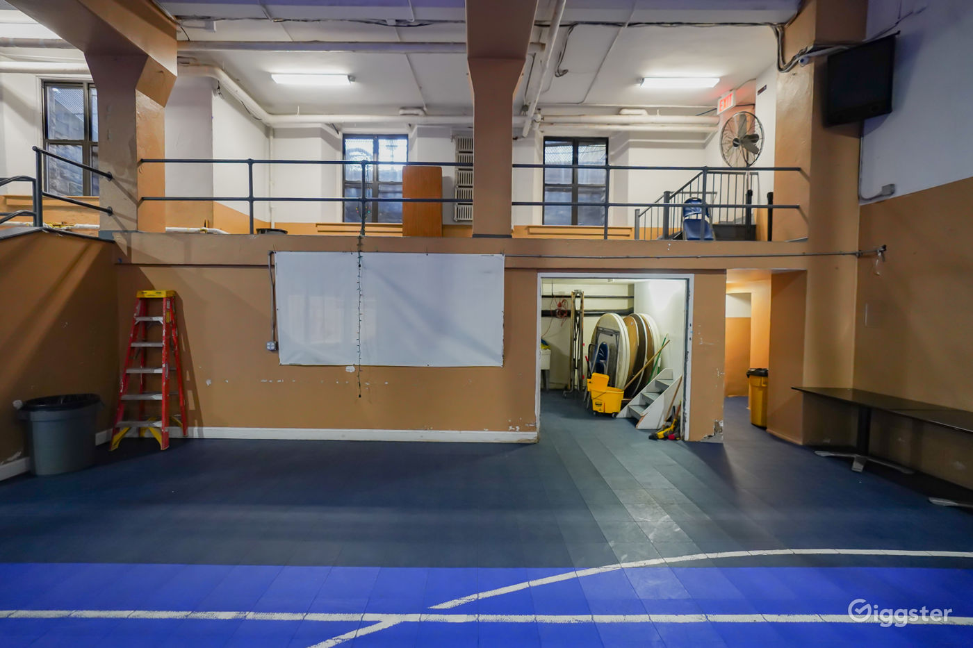 Blue Basketball Court with Arena, Stage | Rent this location on Giggster