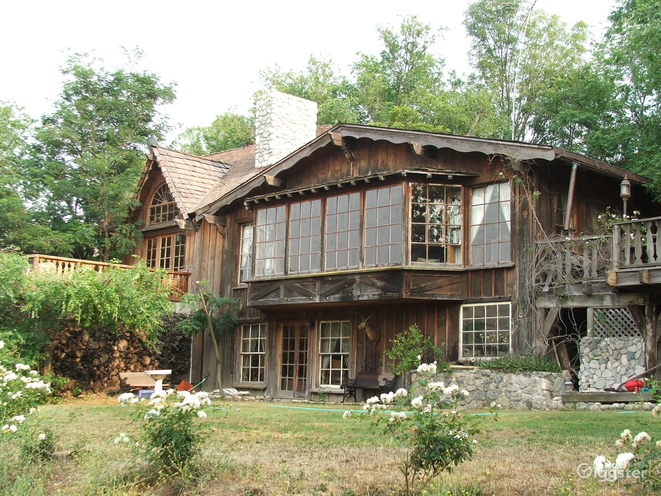 Large wood house in a rustic setting | Rent this location on Giggster
