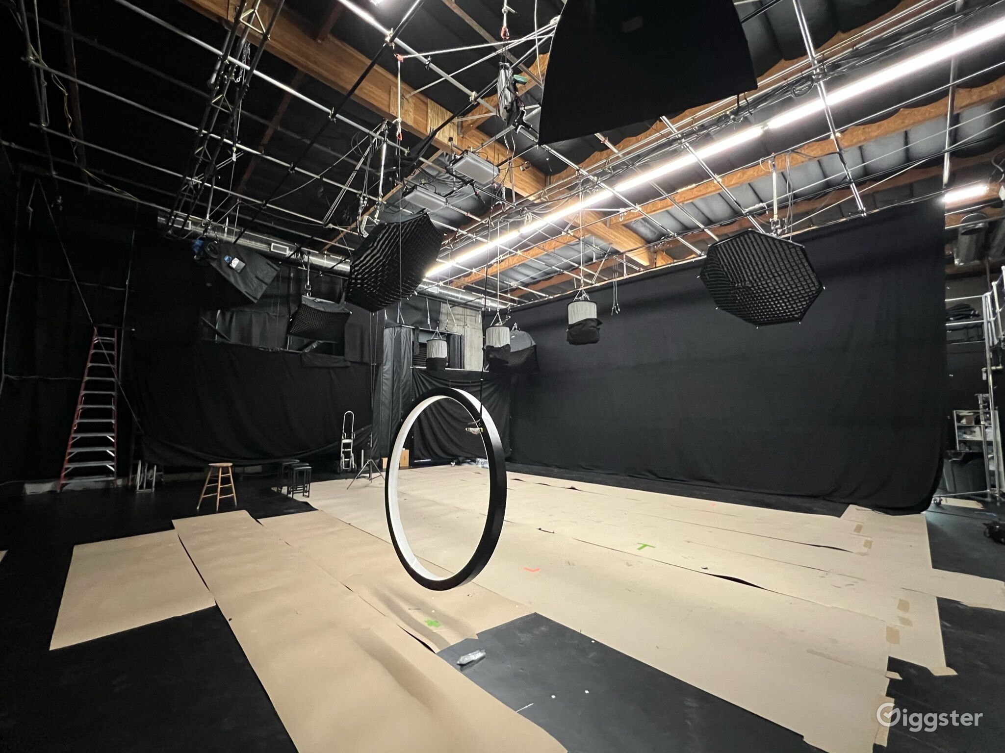 Large Black Void Blackout Stage with Grid | Rent this location on Giggster